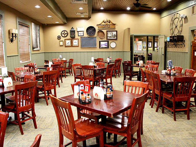 Inside, wooden chairs and tables await beneath an eclectic wall gallery &ndash; a dining room that feels like your favorite uncle's den, if your uncle were a barbecue genius.