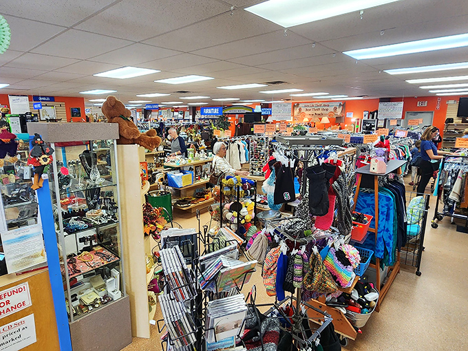 The bustling interior is organized chaos at its finest. Orange walls create a cheerful backdrop for this kaleidoscope of pre-loved possibilities.