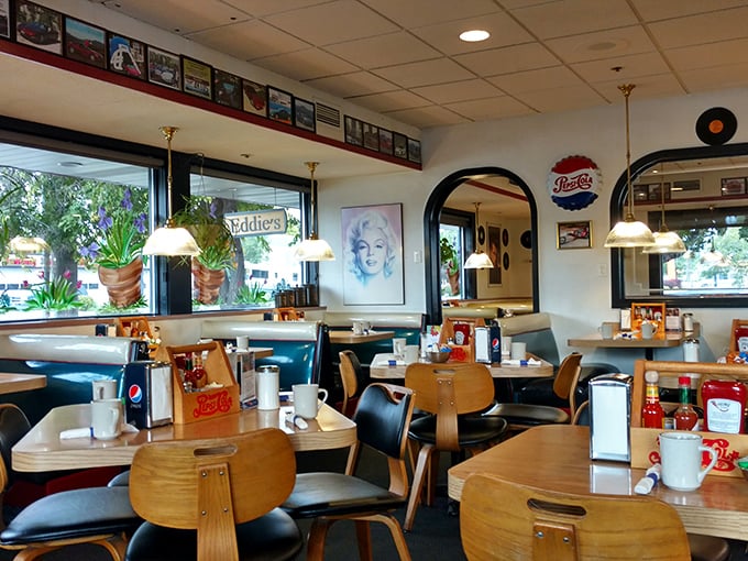 Step inside and time travels backward – blue vinyl booths, wooden tables, and Marilyn Monroe watching over your breakfast adventures with timeless approval.