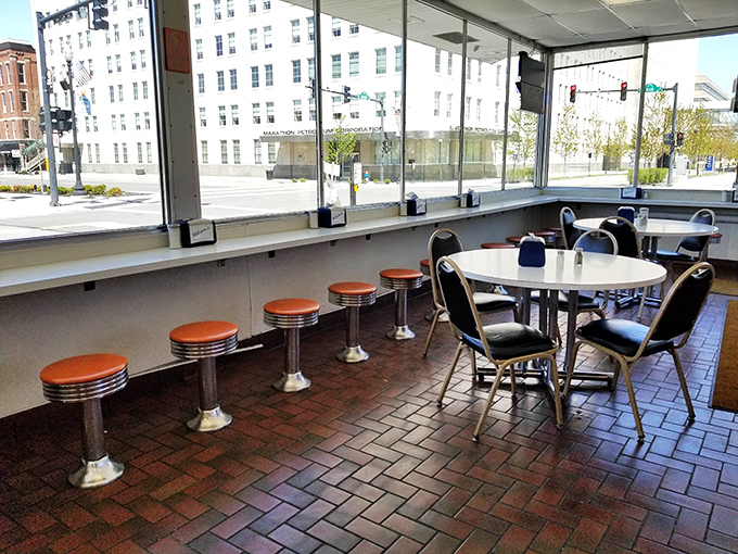 Vintage memorabilia and tin ceilings create an atmosphere that feels authentically nostalgic, not manufactured by some corporate design committee.