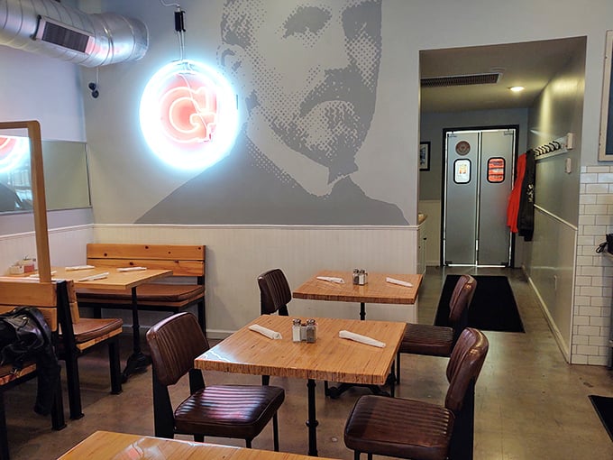 Inside, the sleek interior balances modern design with classic diner comfort. That neon "G" sign isn't just lighting &ndash; it's a beacon of culinary promise.