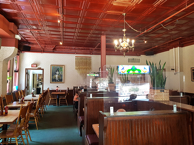 Beneath that gorgeous pressed tin ceiling, wooden booths invite you to settle in for a meal that feels like coming home&mdash;even if you've never been here before.