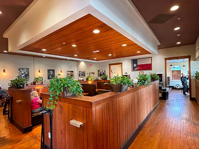 Warm wood tones, potted plants, and the Texas flag create that perfect "special but comfortable" atmosphere where memorable meals and conversations naturally unfold.