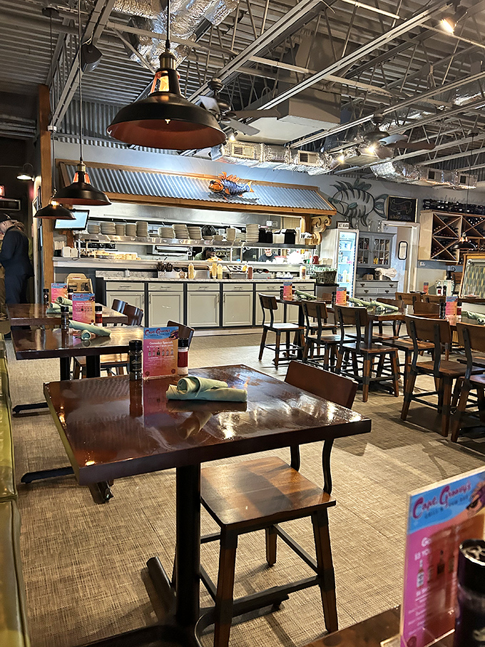 Industrial meets nautical inside, where wooden tables, exposed beams, and that watchful shark mural create the perfect seafood sanctuary.