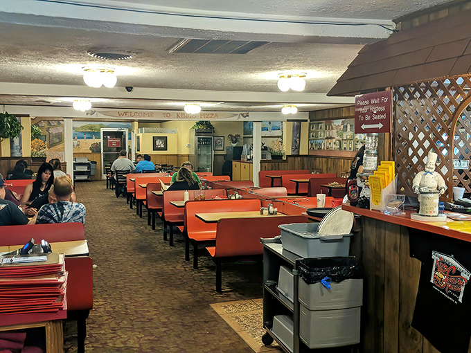 Inside, those classic orange booths aren't trying to impress Instagram&mdash;they're promising comfort while you focus on what really matters: the food.