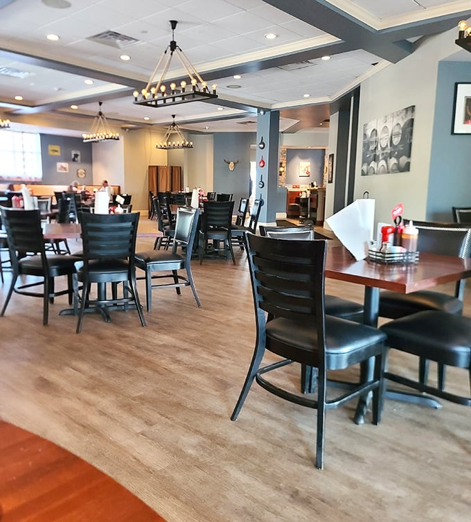 Modern rustic charm meets comfort in this thoughtfully designed dining room. Those rope chandeliers cast the kind of glow that makes everyone look like they've made excellent life choices.