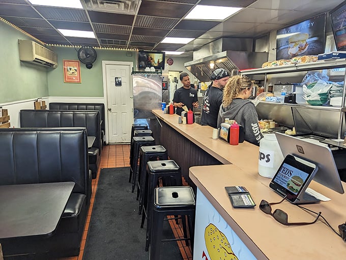 Inside Ted's, the counter seating puts you front-row for the steamed burger spectacle&mdash;dinner and a show!