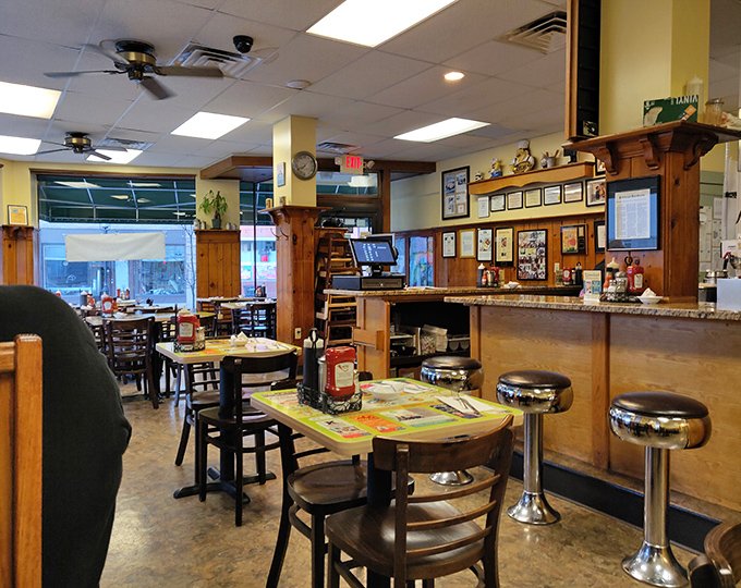 Wood paneling and cozy booths create that perfect "everybody knows your name" vibe where breakfast dreams become delicious reality.