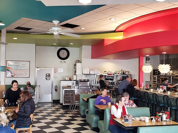 Birch tree murals and cozy red booths create the perfect nest for lingering conversations.