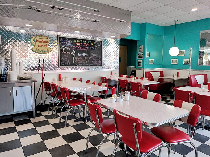 Classic Americana at its finest: turquoise walls, chrome accents, and cherry-red vinyl booths create the perfect backdrop for comfort food conversations.