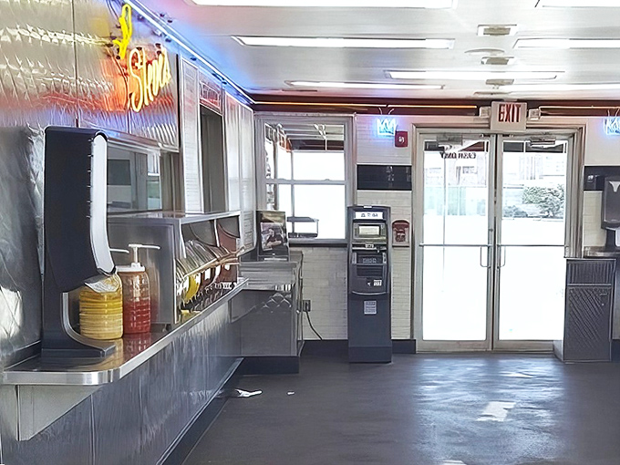 Inside, the gleaming stainless steel and neon create a temple of simplicity where the focus remains squarely on the food, not the frills.