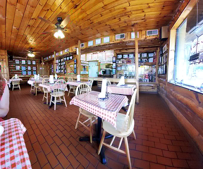 Warm wood paneling, checkered tablecloths, and decades of barbecue history create the perfect setting for meat-induced euphoria.