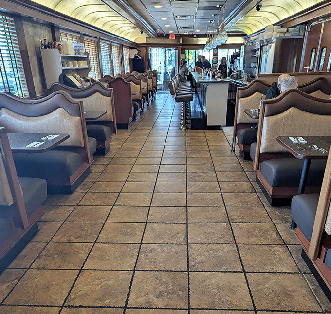 The quintessential diner interior—where booths aren't just seating, they're front-row tickets to the greatest show on earth: breakfast served all day.