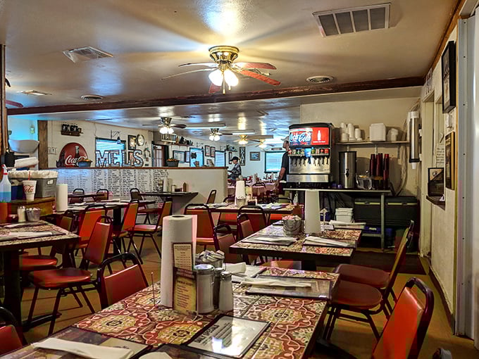 Inside, warm wood tones and brick accents create the perfect backdrop for the serious business of barbecue appreciation.