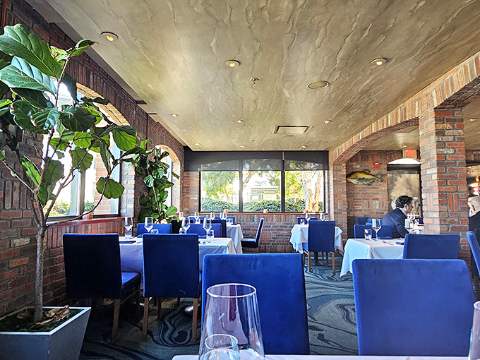 The Bay Bridge isn't just visible from these windows &ndash; it's practically a dining companion, framed by exposed brick that makes industrial chic feel like home.