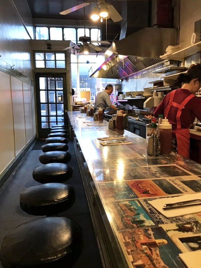 Twelve lucky stools, one legendary counter. The postcard-embedded surface tells stories of faraway places while breakfast dreams come true right before your eyes.