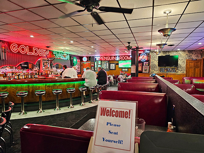 Step inside and the neon glow welcomes you like an old friend, with red vinyl booths that have cushioned generations of happy diners.