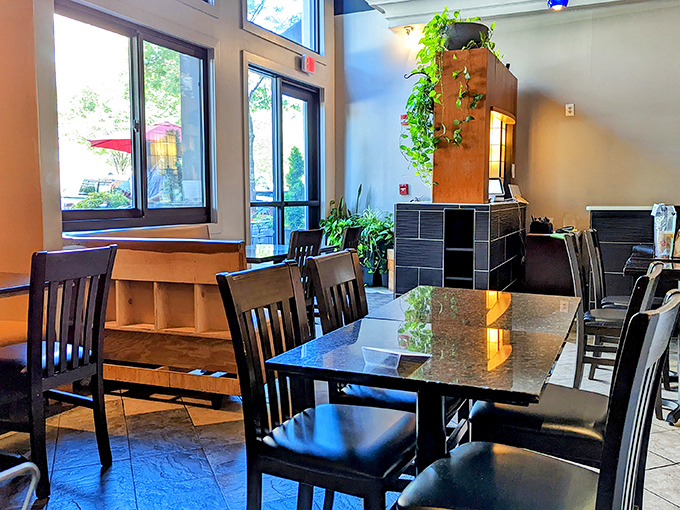 Simple elegance defines the dining space, where granite tables and wooden chairs invite you to focus on what really matters&mdash;the food.