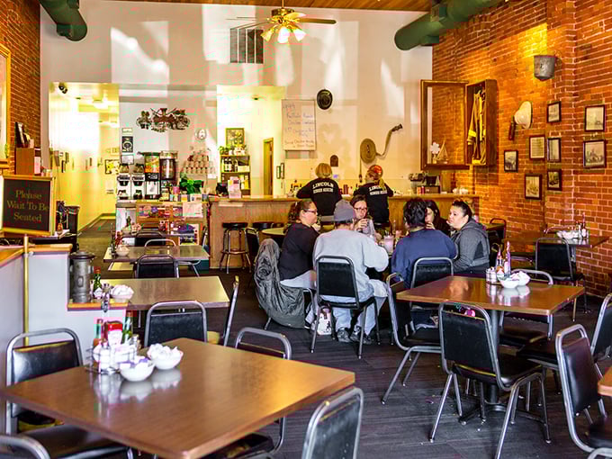 Exposed brick, soaring ceilings, and simple tables create the perfect backdrop for serious comfort food without pretentious nonsense.