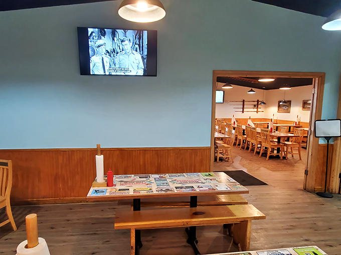 Simple wooden tables and bench seating create that "come as you are" vibe where conversations flow as freely as the sweet tea.