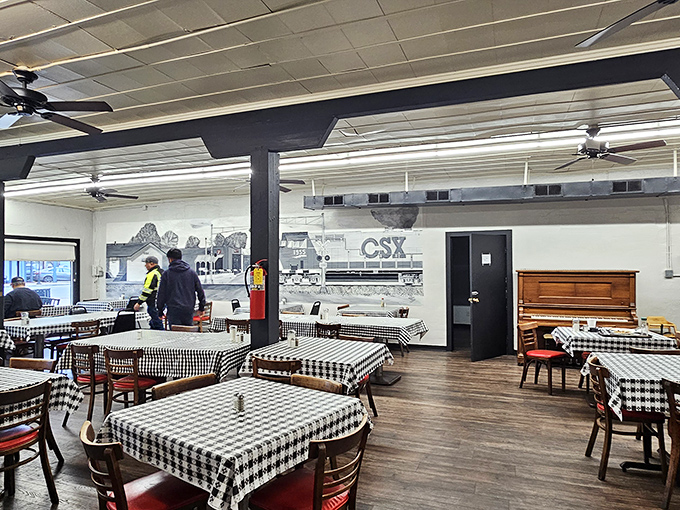 Classic black and white checkered tablecloths and railroad murals transport diners to a simpler time when conversation trumped smartphones.