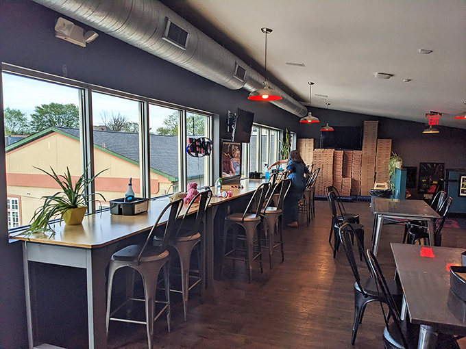 Industrial-chic meets pizza perfection inside Futuro, where exposed ductwork watches over diners embarking on delicious Detroit-style adventures.