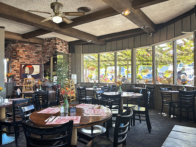 Wooden beams, brick walls, and abundant natural light create that perfect maritime atmosphere where seafood somehow tastes even better.