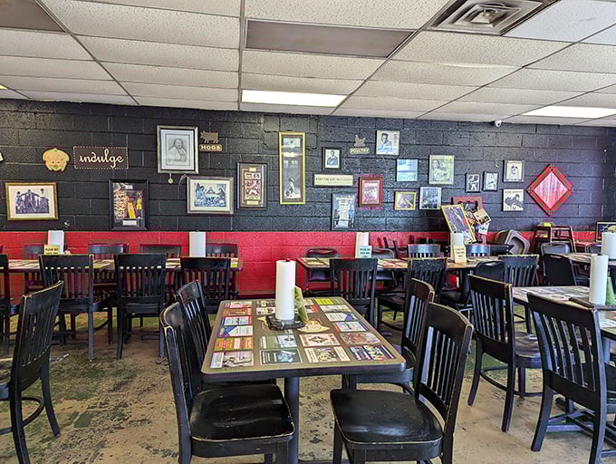 The black and red interior walls adorned with framed memories tell stories while you eat. It's the kind of place where every table feels like the best seat in the house.