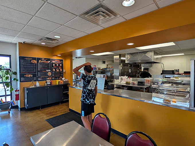 Where culinary magic happens – the open kitchen concept lets you witness your comfort food dreams coming to life.