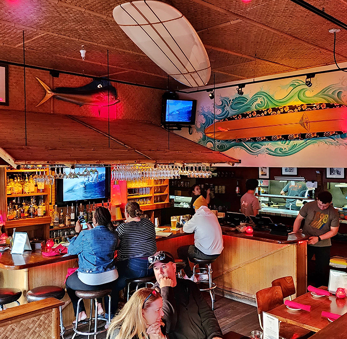 Surfboards and marlins hang from bamboo-lined ceilings, creating that perfect "I've escaped to somewhere special" feeling the moment you walk in.