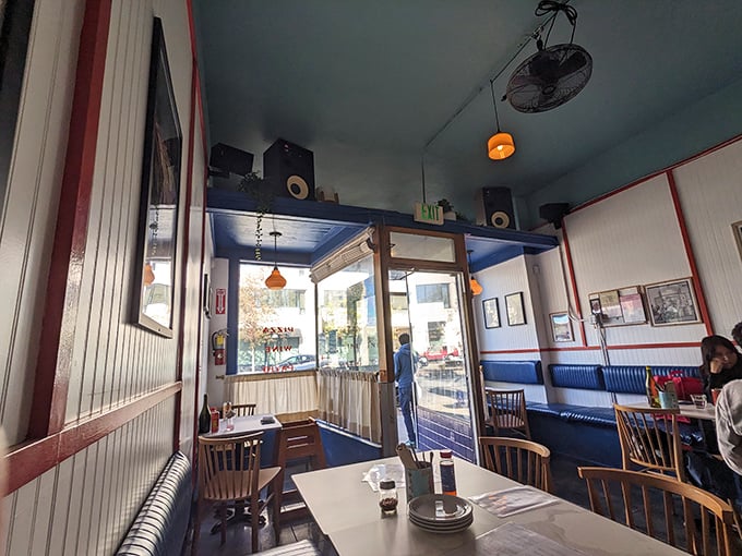 Cozy doesn't begin to describe this intimate dining space. The blue ceiling and warm pendant lights create a neighborhood vibe that feels like home.