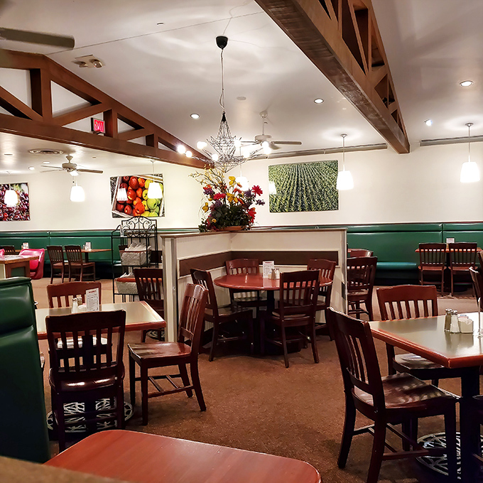 Wooden beams, green booths, and farm-fresh imagery create that perfect "grandma's kitchen meets modern comfort" vibe that makes you want to settle in for the long haul.