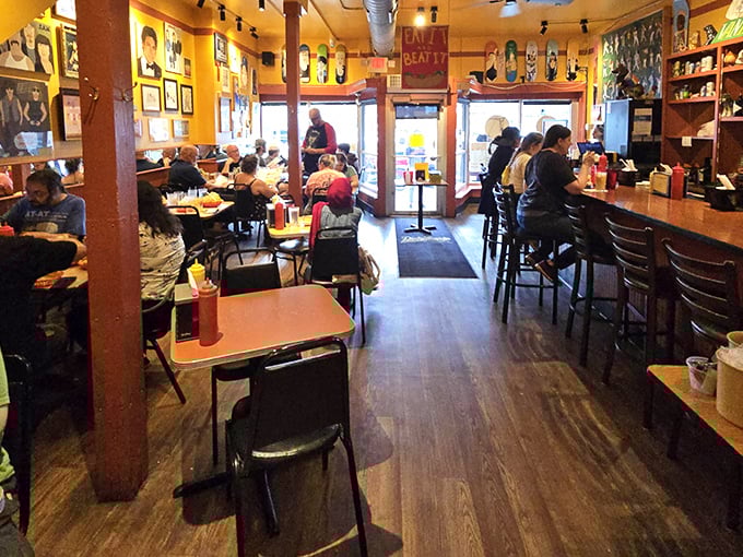 Step inside and you're greeted by vibrant walls, local art, and the unmistakable buzz of people having more fun than they expected to have at a hot dog joint.