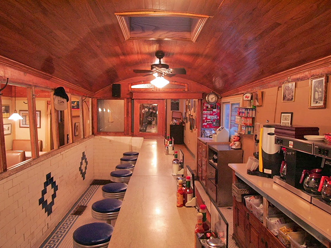 Step inside and you're transported to another era. This authentic railroad dining car, with its curved wooden ceiling and counter seating, defines nostalgic Americana.