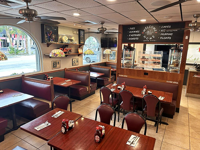 Step inside and time slows down &ndash; burgundy booths, wooden tables, and ceiling fans create that perfect nostalgic atmosphere where coffee somehow tastes better and conversations flow easier.