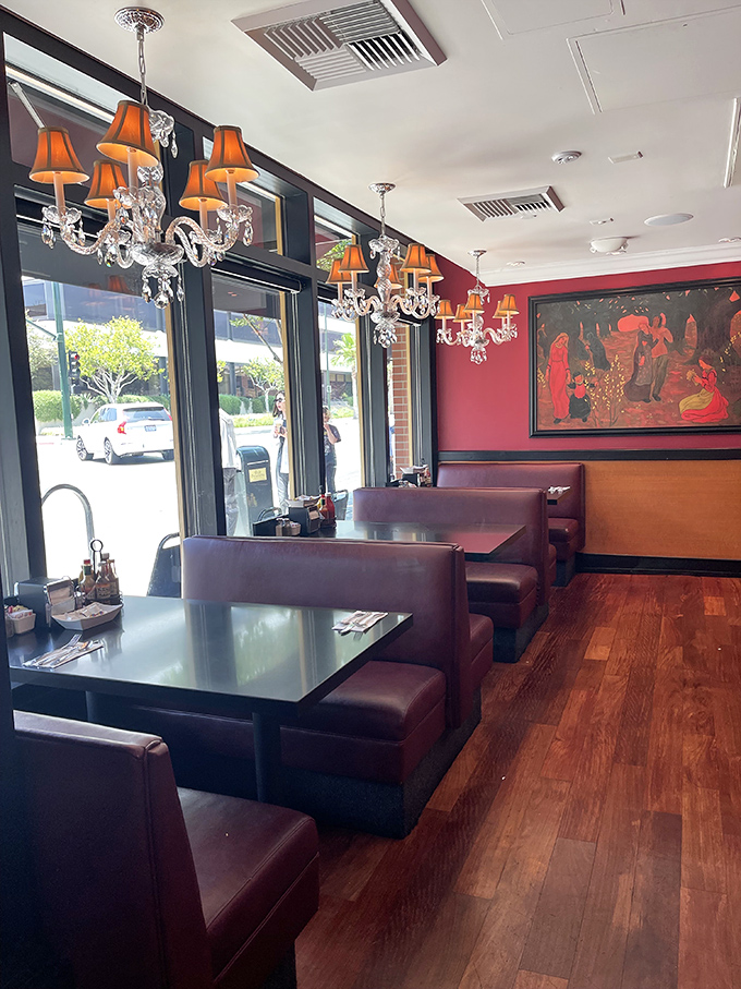 Crystal chandeliers with orange lampshades? It's like your grandmother's formal dining room decided to open a diner&mdash;and it works beautifully.