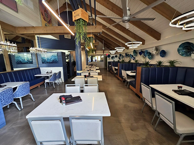 Nautical elegance with a touch of Florida charm &ndash; those blue booths practically whisper "fresh catch of the day."