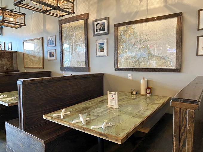 Nautical maps and wooden booths create the perfect maritime atmosphere &ndash; like being in a ship captain's cozy dining room, minus the seasickness.