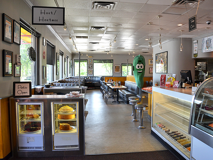Inside, the classic diner aesthetic transports you straight to Manhattan, complete with that whimsical pickle mascot standing guard over your dining experience.