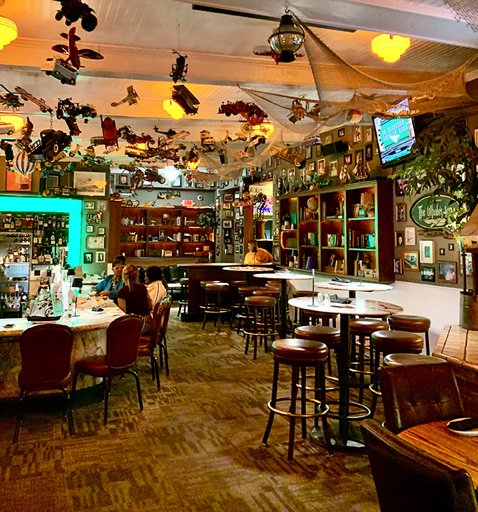 Step inside and look up &ndash; model planes, boats, and curiosities dangle from the ceiling like a maritime museum curated by someone who really knows how to have fun.