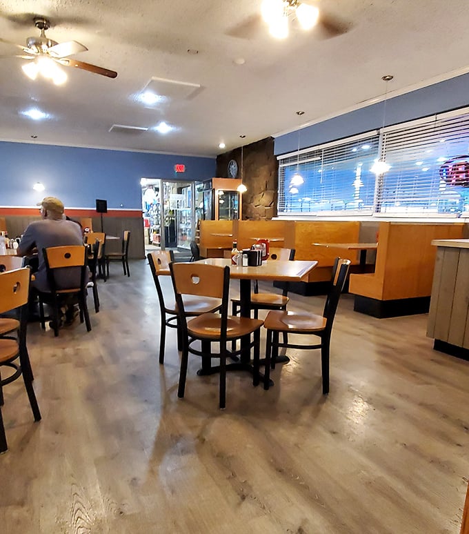 Classic wooden booths and blue walls create that perfect "everybody knows your name" atmosphere. The kind of place where calories don't count before noon.