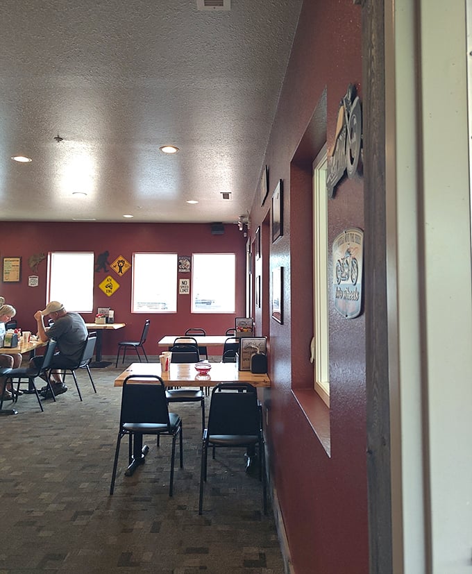 Inside, red walls and simple tables create the kind of unpretentious comfort that fancy restaurants spend millions trying to fake.