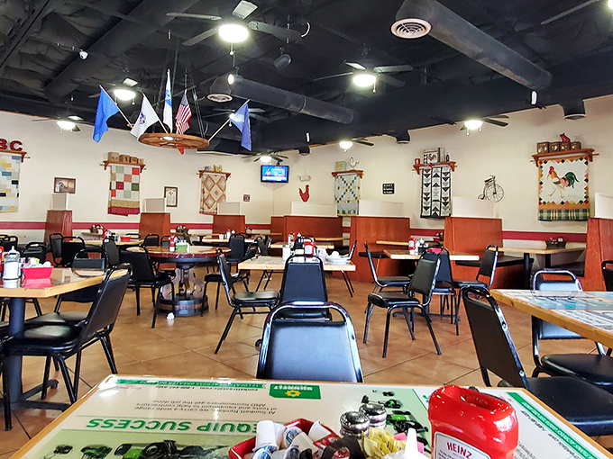 Flags hang proudly overhead in a dining room where comfort trumps pretension. This is breakfast democracy in action.