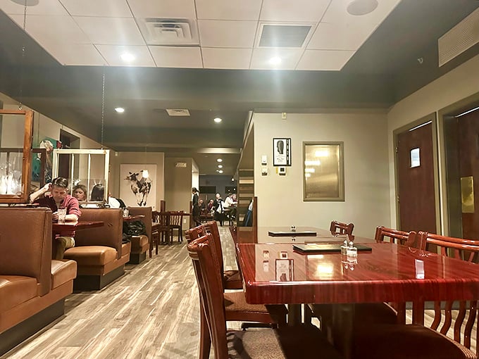 Warm wood tones and comfortable seating create that perfect sweet spot between casual comfort and subtle elegance—exactly where great meals should happen.