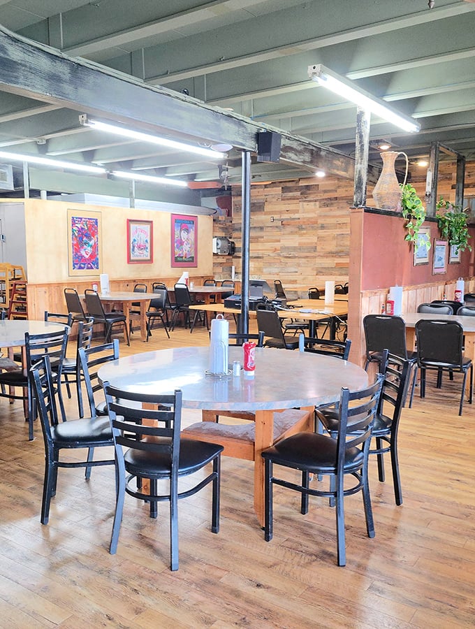 Simple tables, wooden accents, and colorful local art create the perfect backdrop for food that needs no fancy setting to shine.