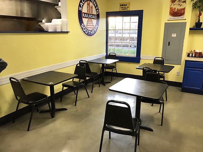 Bright yellow walls and simple furnishings create a no-nonsense dining space where the food, not the decor, takes center stage.