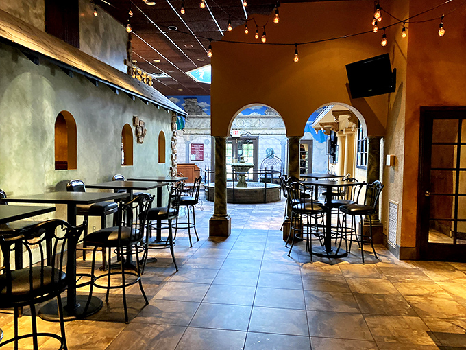 Sunlight floods through panoramic windows, illuminating exposed brick walls and creating that perfect "I could stay here all day" atmosphere. The purple ceiling accent adds just enough whimsy.