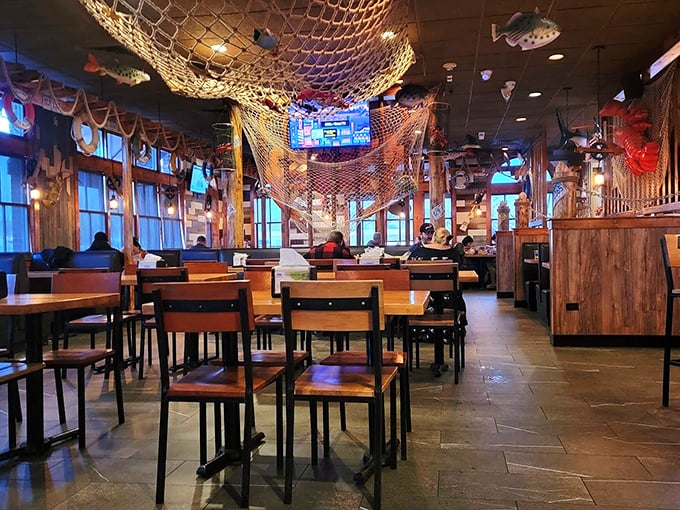 Fishing nets drape from the ceiling like aquatic chandeliers, creating a maritime wonderland that's equal parts kitschy and charming.