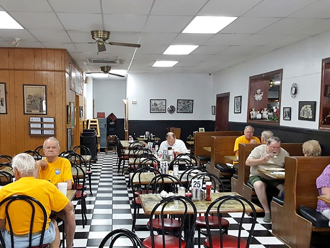 Black and white checkered floors lead you through a diner where conversations flow as freely as the coffee, and every regular has their designated spot.