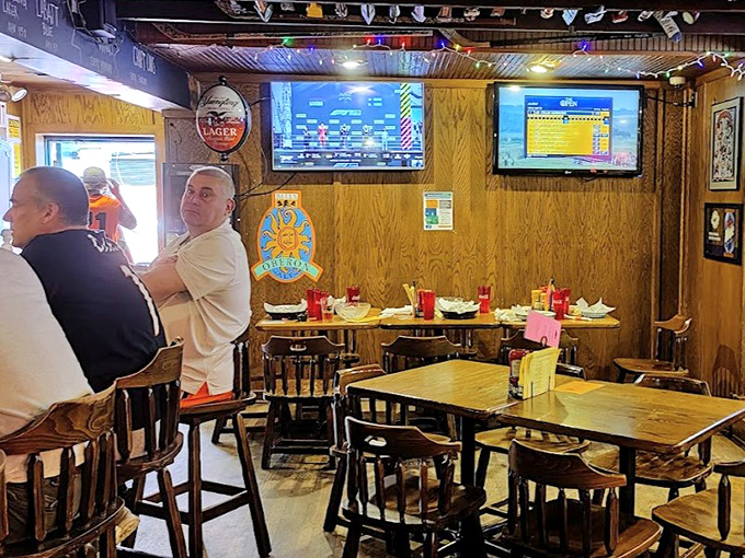Wooden tables, classic chairs, and TV screens create that perfect "everybody knows your name" vibe where memories are made between bites.